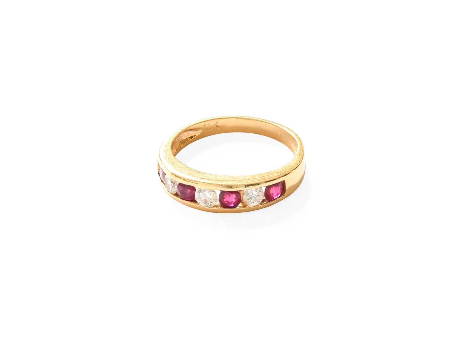 Lot 433 - A Ruby and Diamond Half Hoop Ring, four