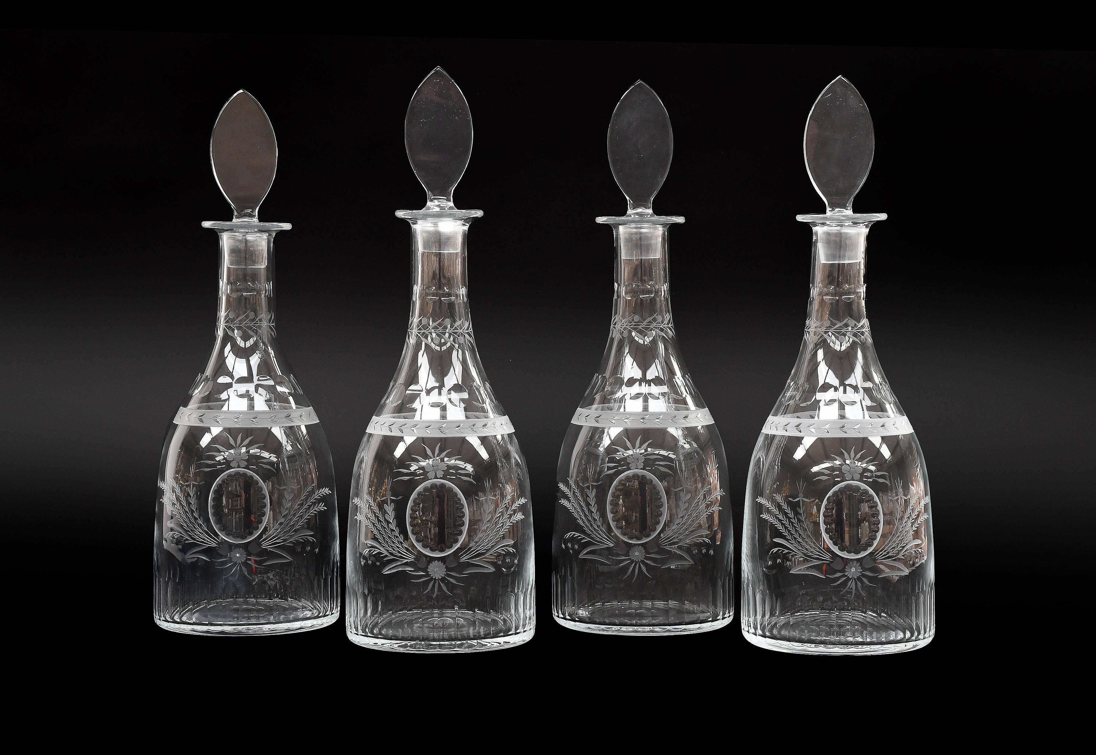 Lot 977 - Four Glass Magnum Decanters, in Regency