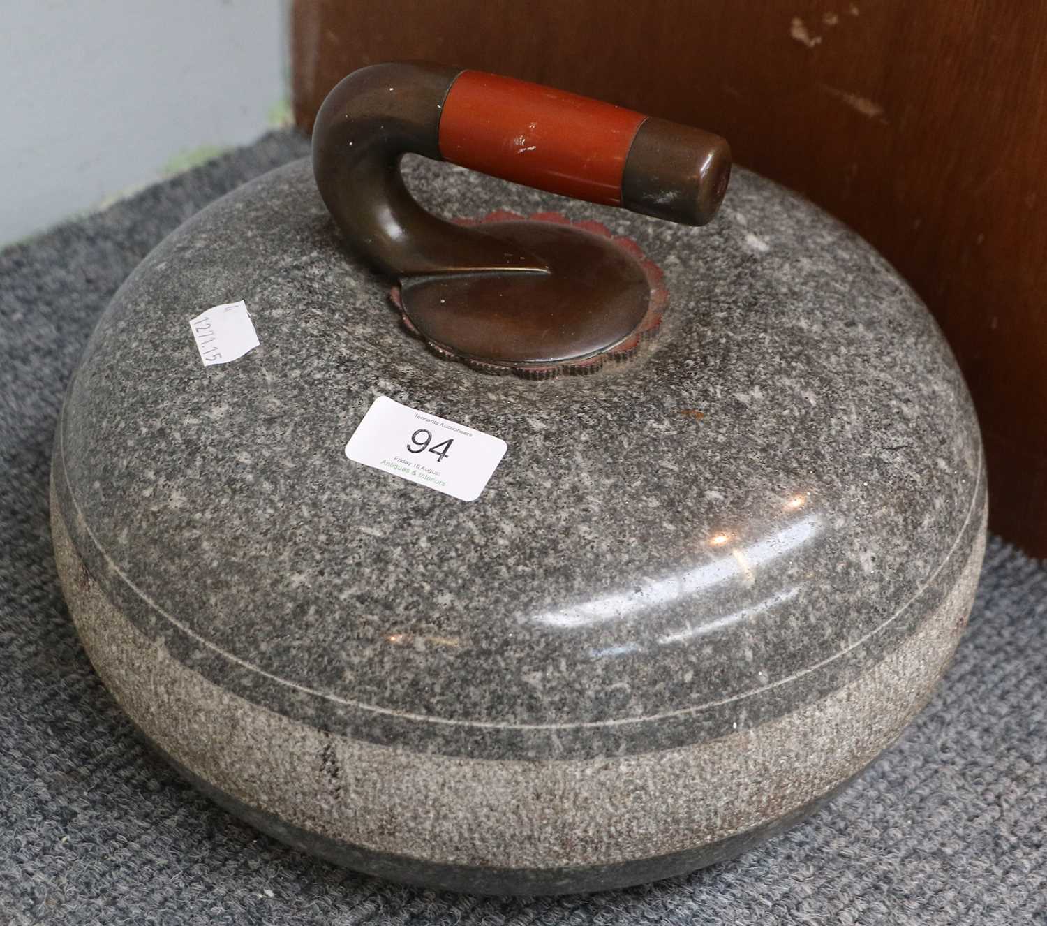 Lot 94 - A Granite Curling Stone with brass handle,