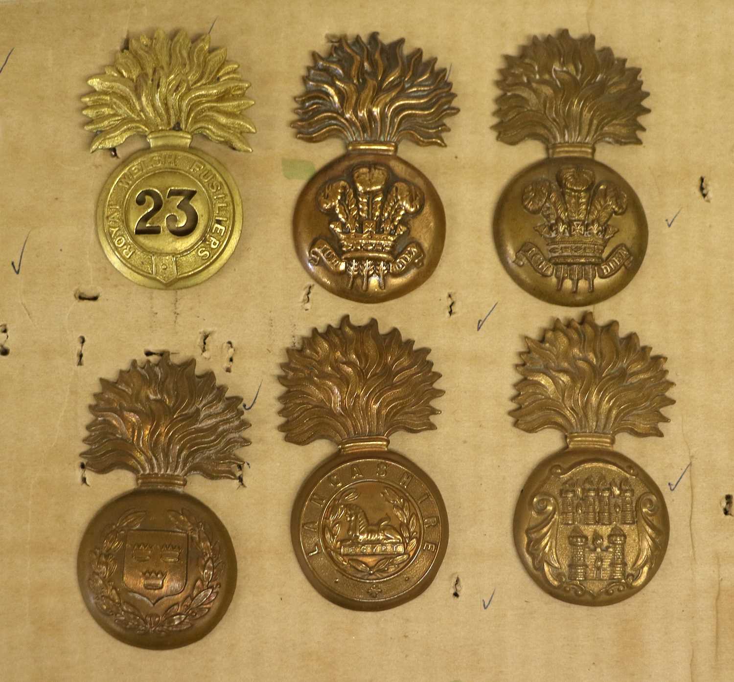 Lot 139 - Six Die-stamped Brass Grenade Badges, to the