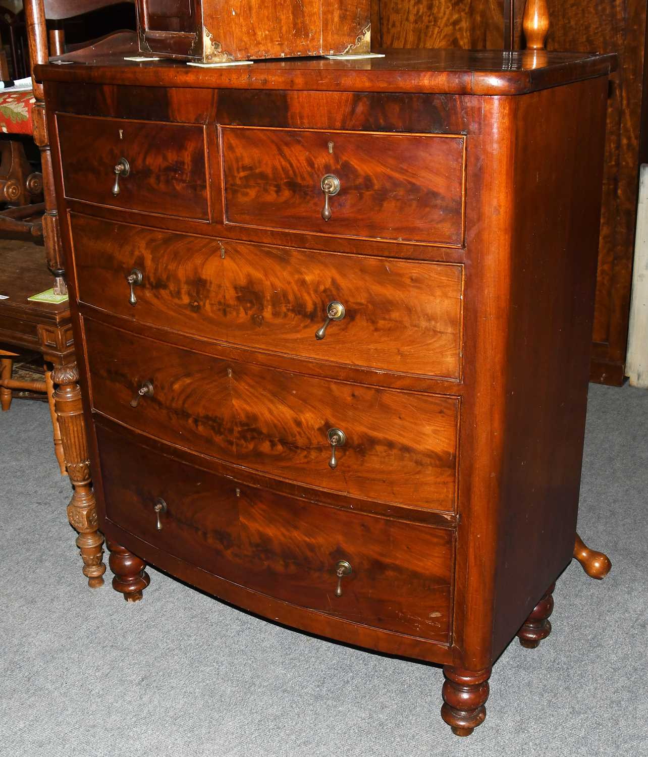 Lot 1243 - A Victorian Mahogany Bow Front Chest, four