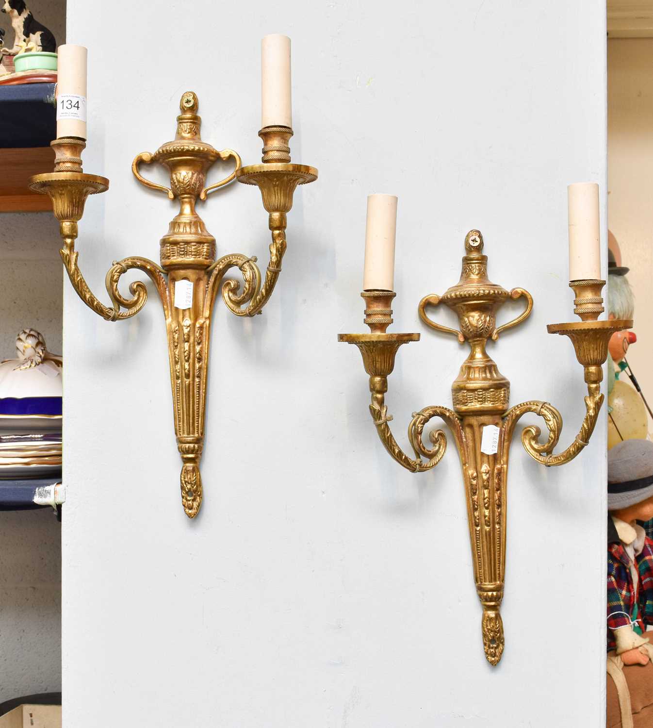 Lot 134 - A Pair of Gilt Brass Adams Style Twin Light