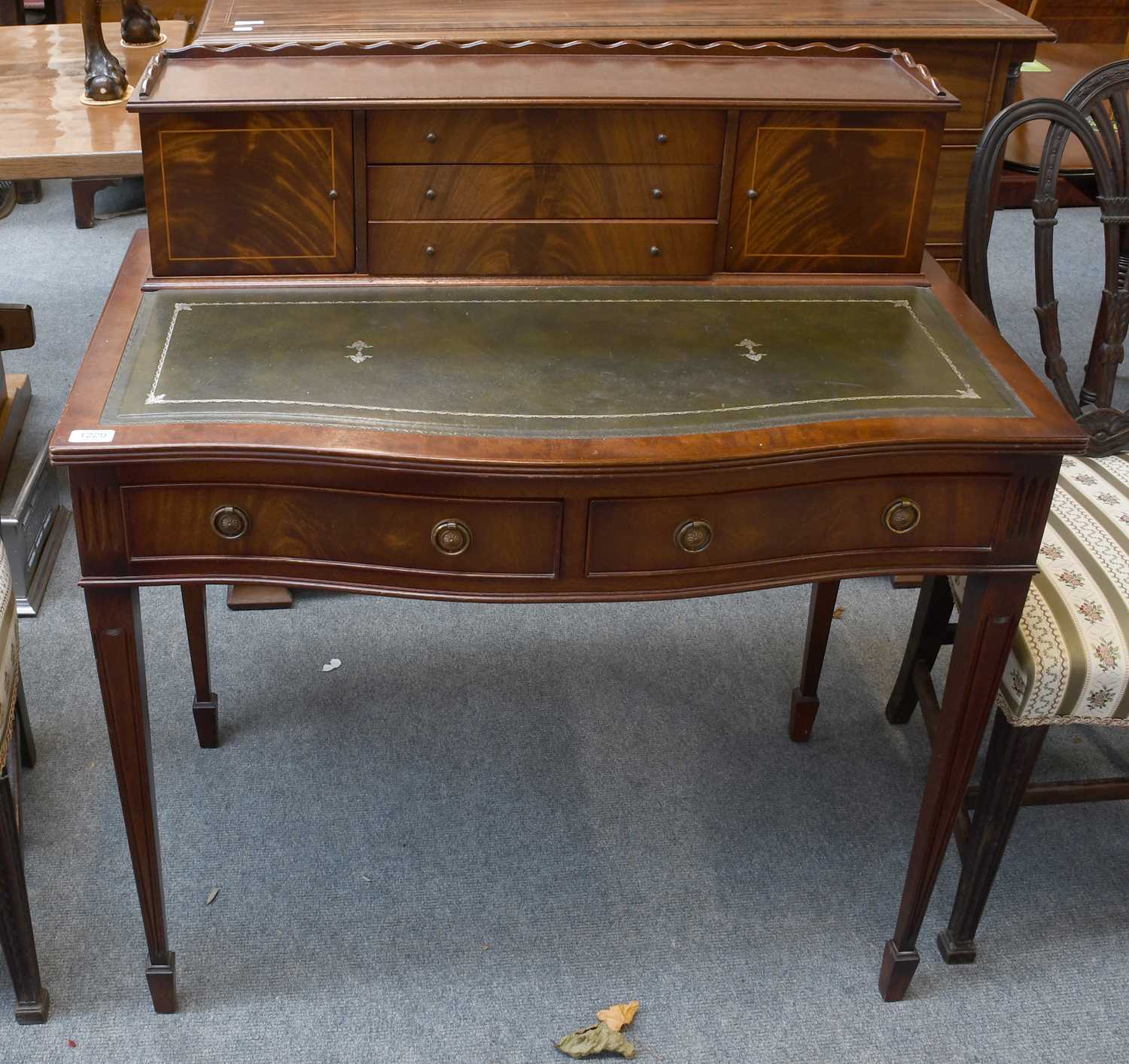 Lot 1229 - A Reproduction Leather Inset Desk, the