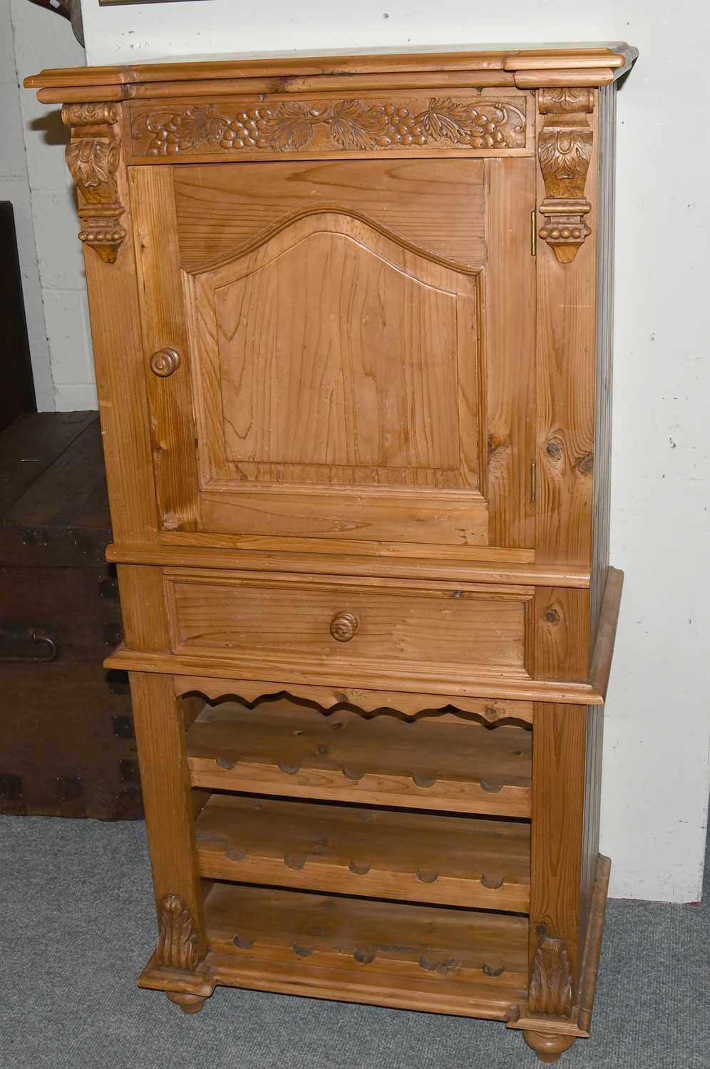 Lot 1213 - A Modern Carved Pine Cupboard, with three