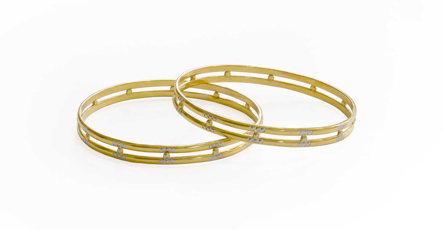 Lot 328 - Two Bangles, formed of two yellow bands with