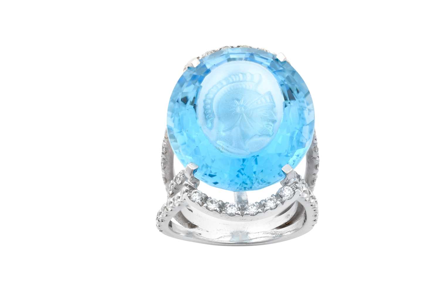 Lot 2257 - A Blue Topaz and Diamond Intaglio Ring the
