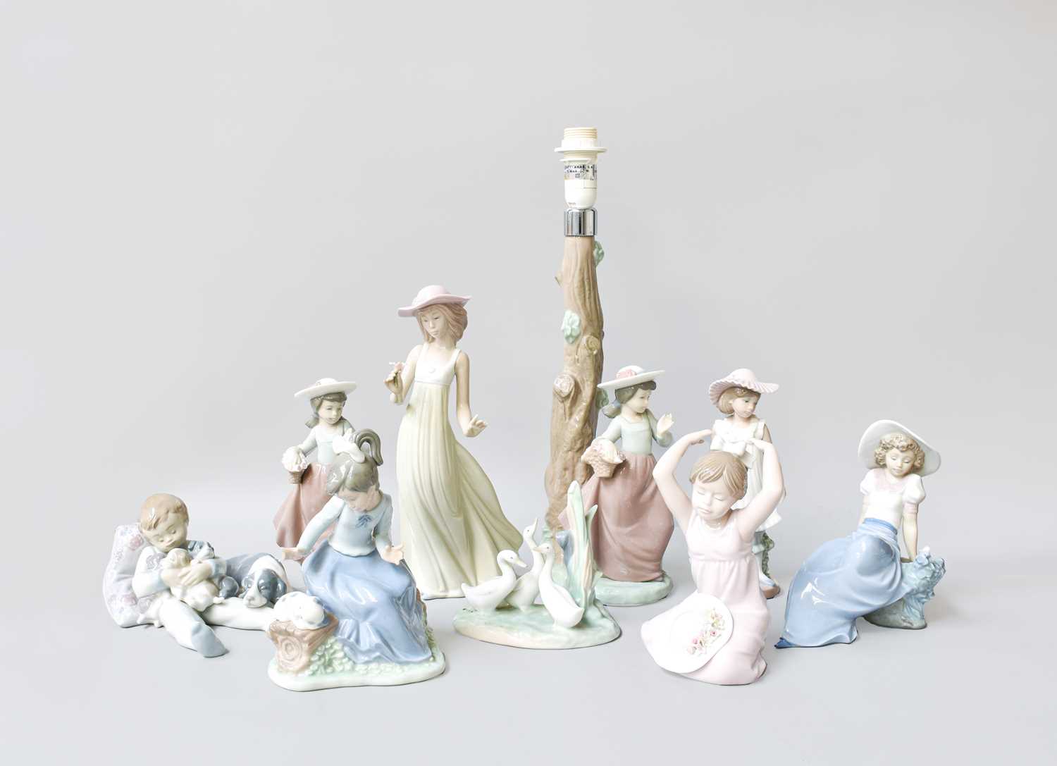 Lot 74 - Nine Spanish Porcelain Figures, including