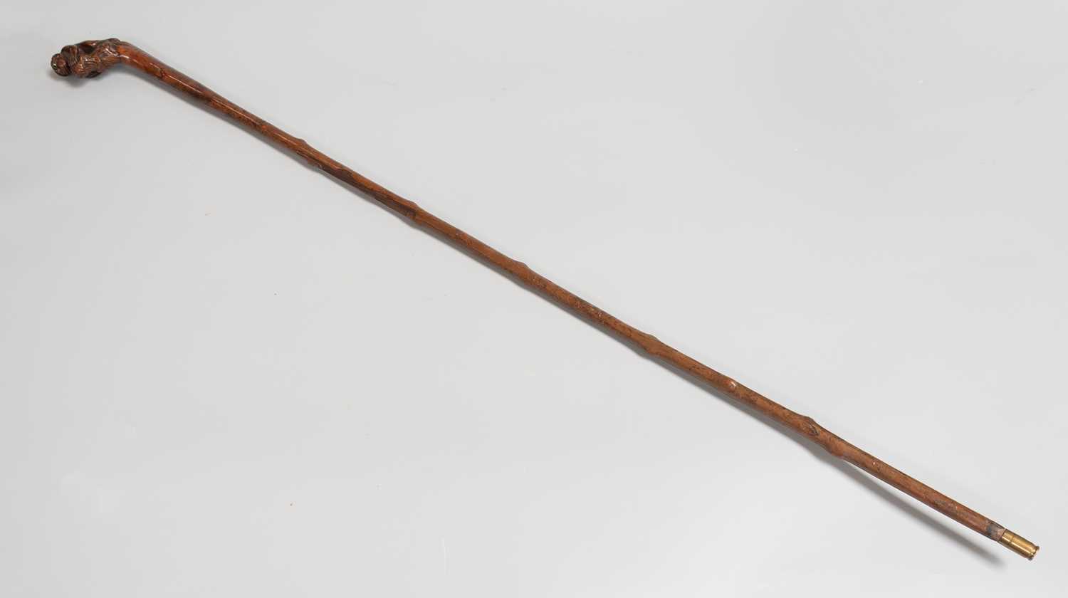 Lot 37 - A Victorian Walking Cane, the handle carved