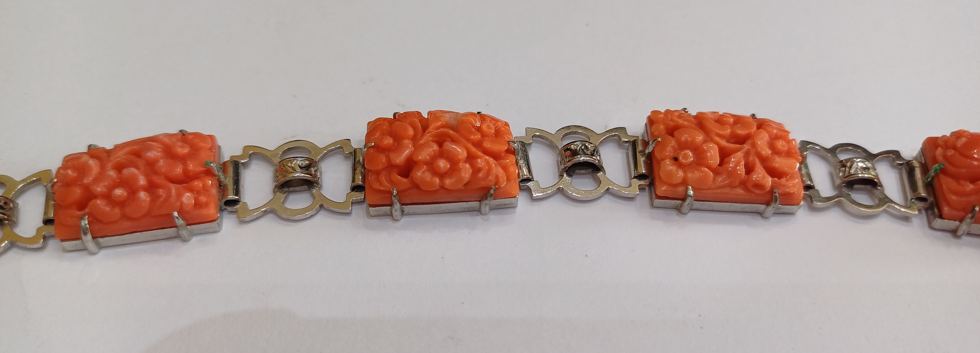 Lot 2362 - A Coral Bracelet five carved coral plaques