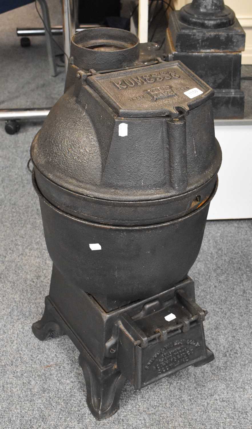 Lot 1158 - A Black Painted Cast Iron Stove, by Smith