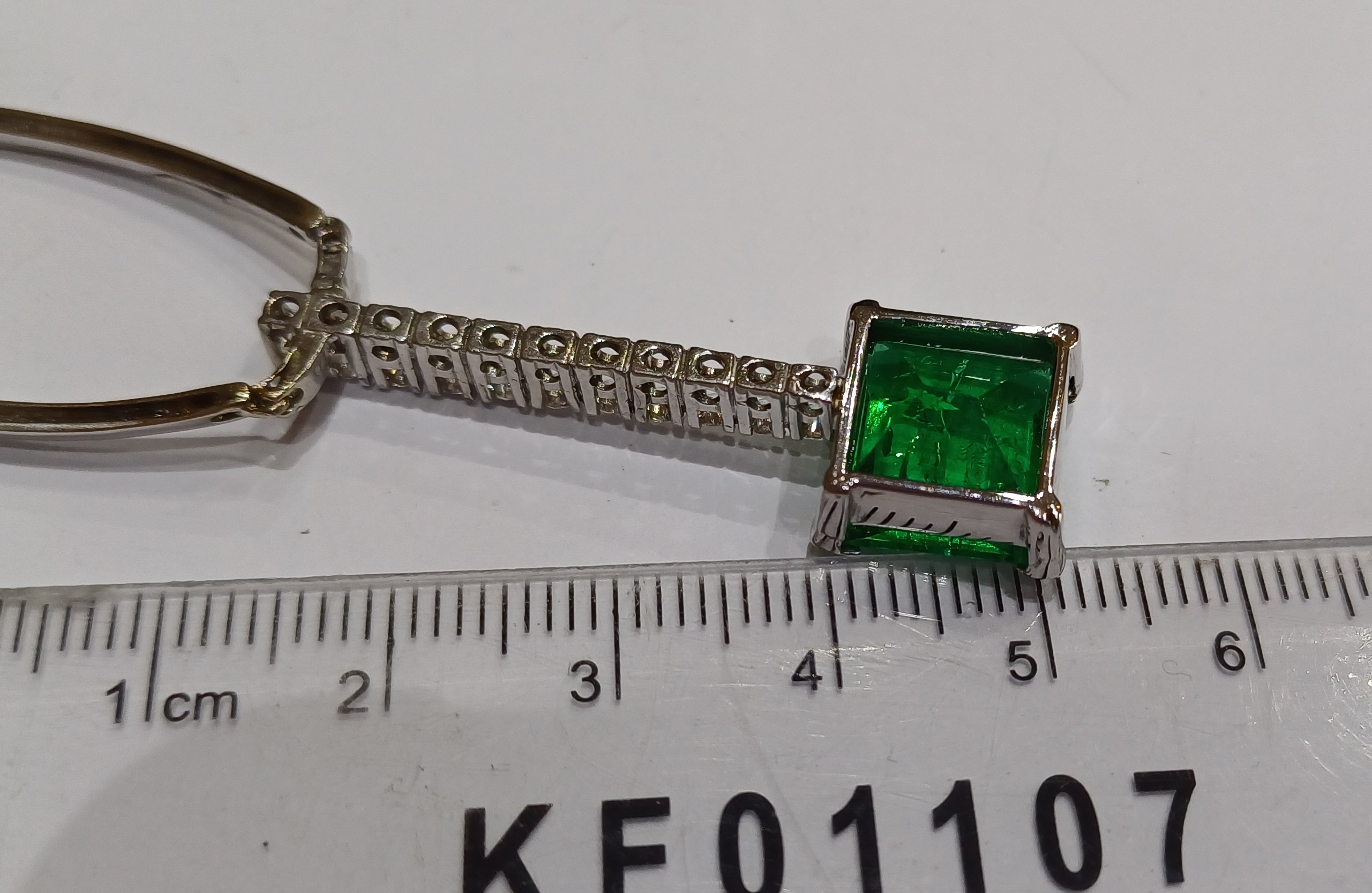 Lot 2303 - A Green Stone and Diamond Necklace a row of