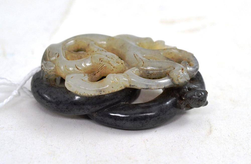 Lot 86 - Chinese carved jade type dragon pendant, late