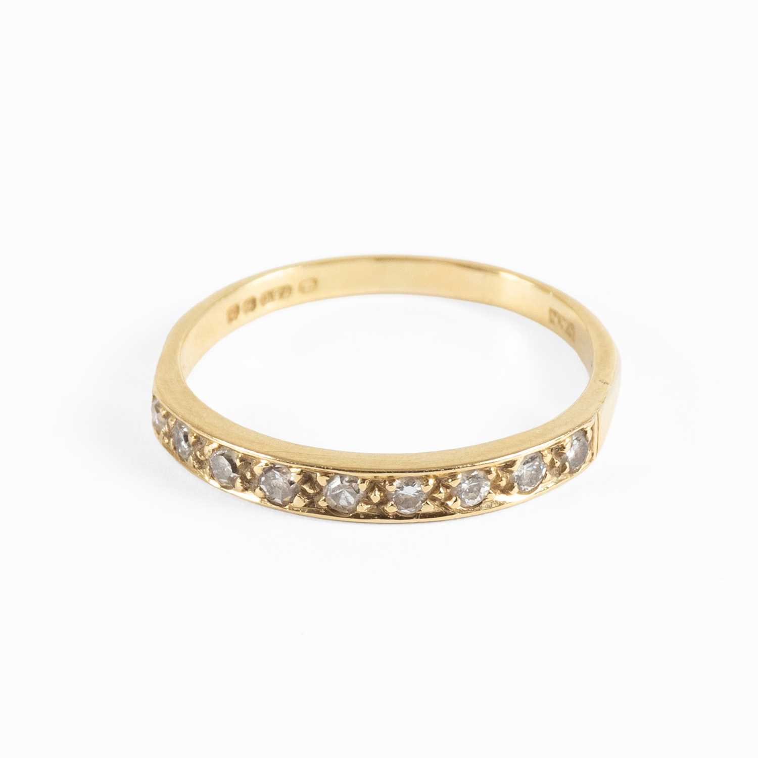 Lot 104 - An 18 Carat Gold Diamond Half Hoop Ring,