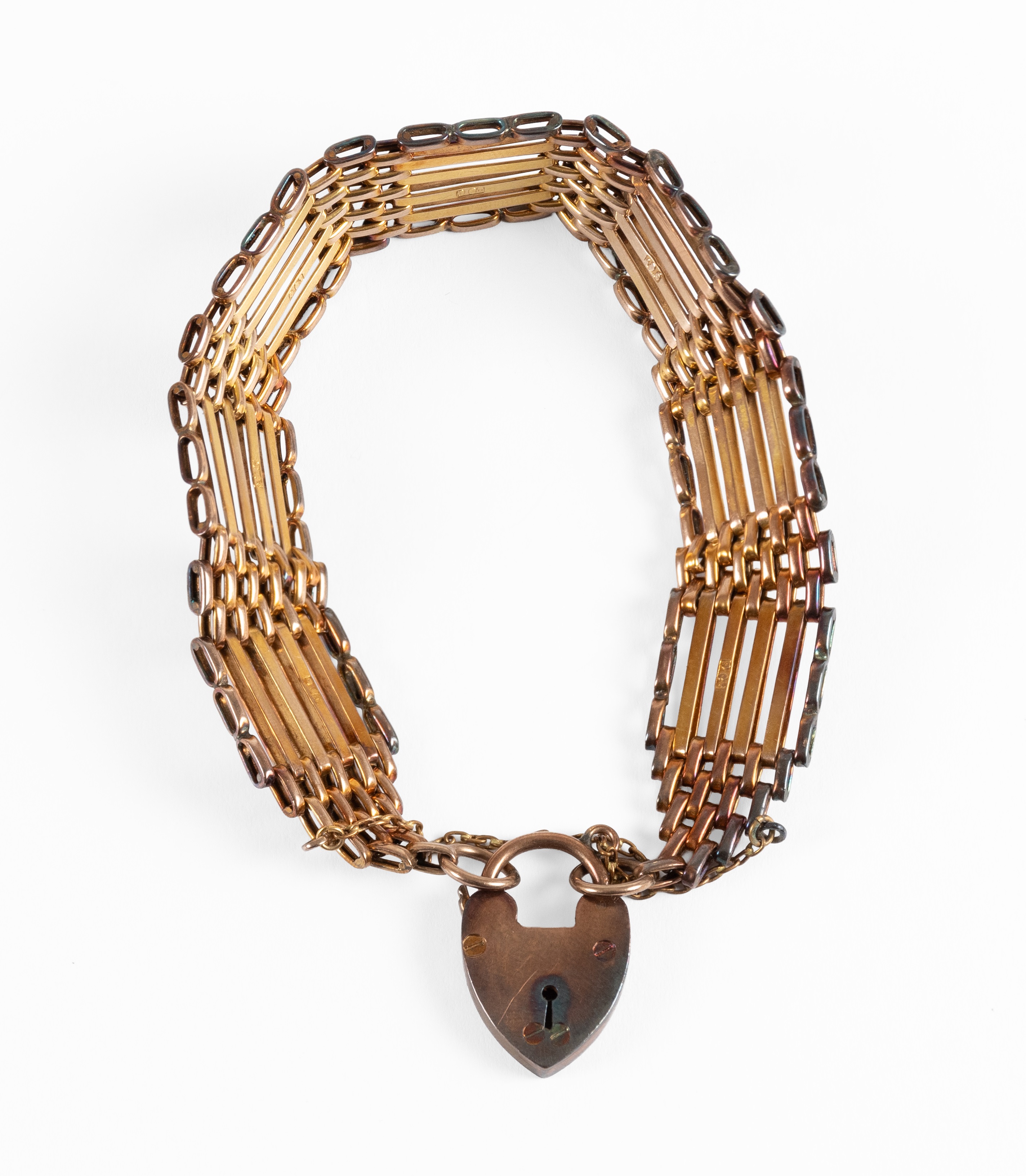 Lot 59 - A Gate Link Bracelet, with a heart-shaped