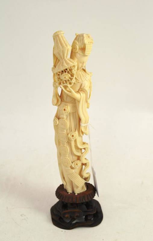 Lot 262 - Carved ivory figures of a lady with basket