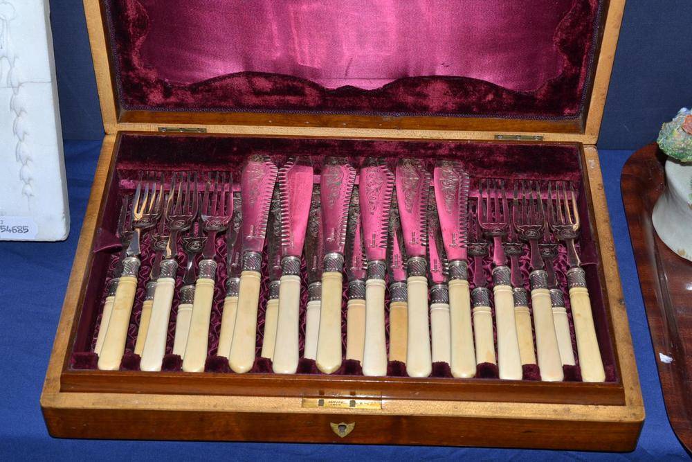 Lot 175 - Set of twelve cased fish eaters with silver