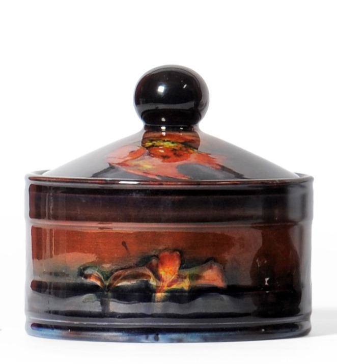 Lot 606 - A William Moorcroft Flambe Fish Tobacco Jar