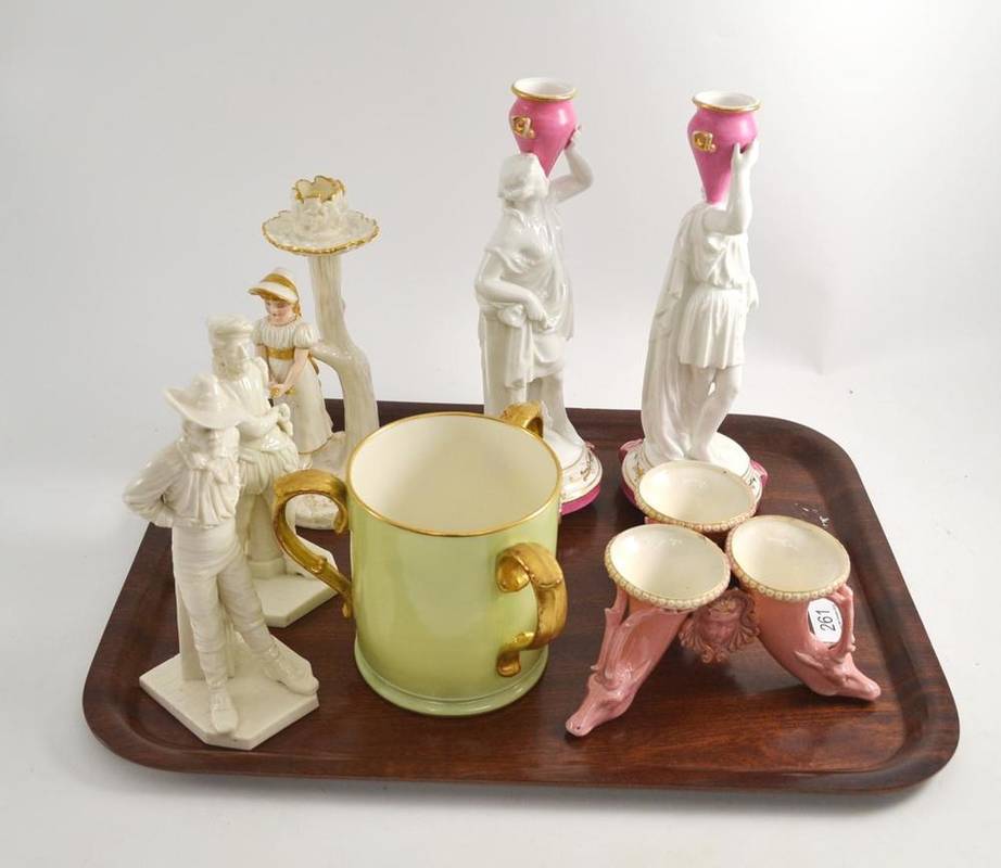 Lot 261 - A Royal Worcester figural candlestick, two