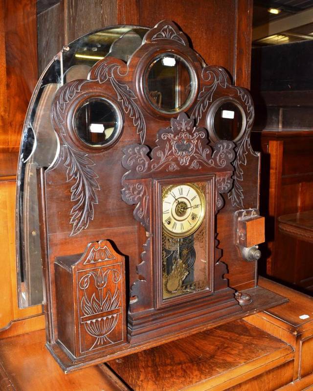 Lot 601 - An alarm shelf clock with mirrored