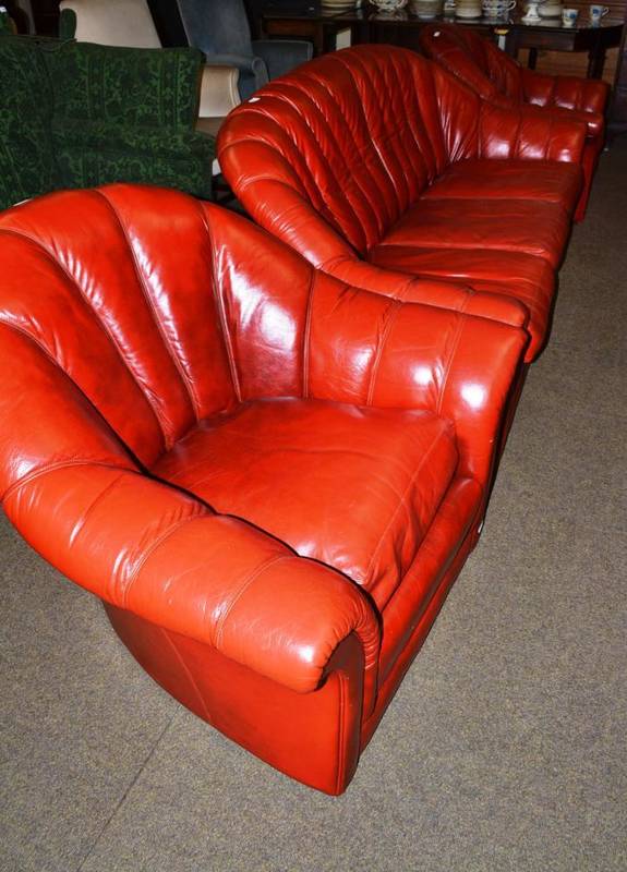 Lot 594 - A Tetrad red leather three piece suite with