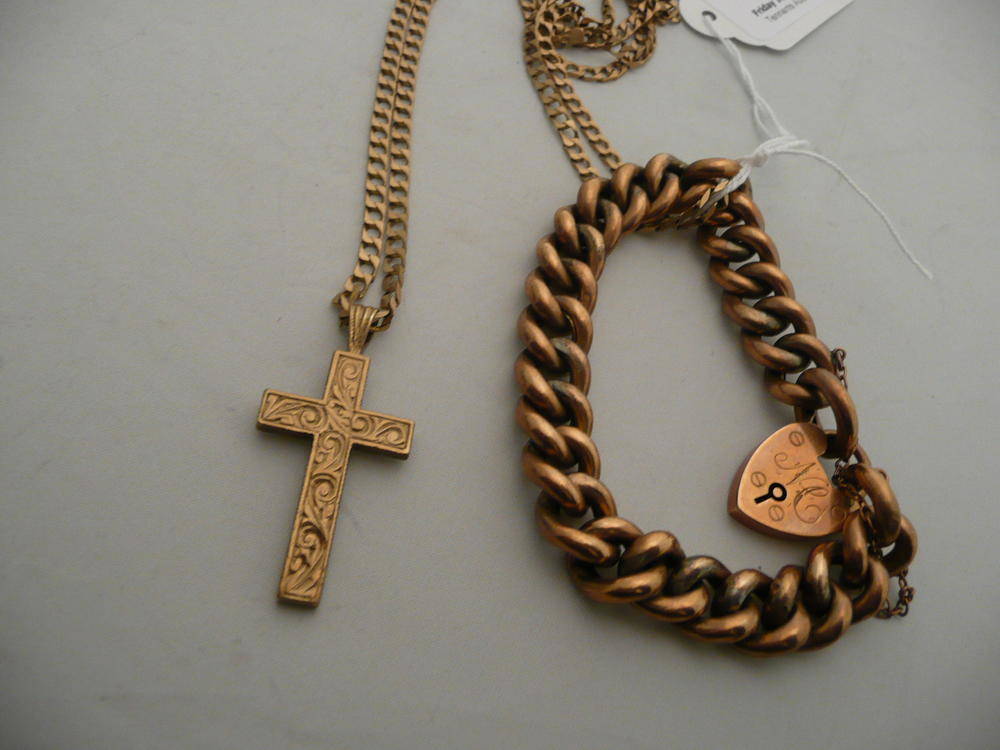 Lot 505 - A 9 carat gold cross on a curb chain and a