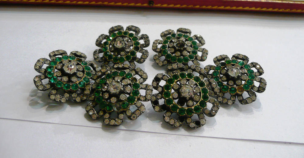 Lot 118 - A set of six paste buttons, of stylised