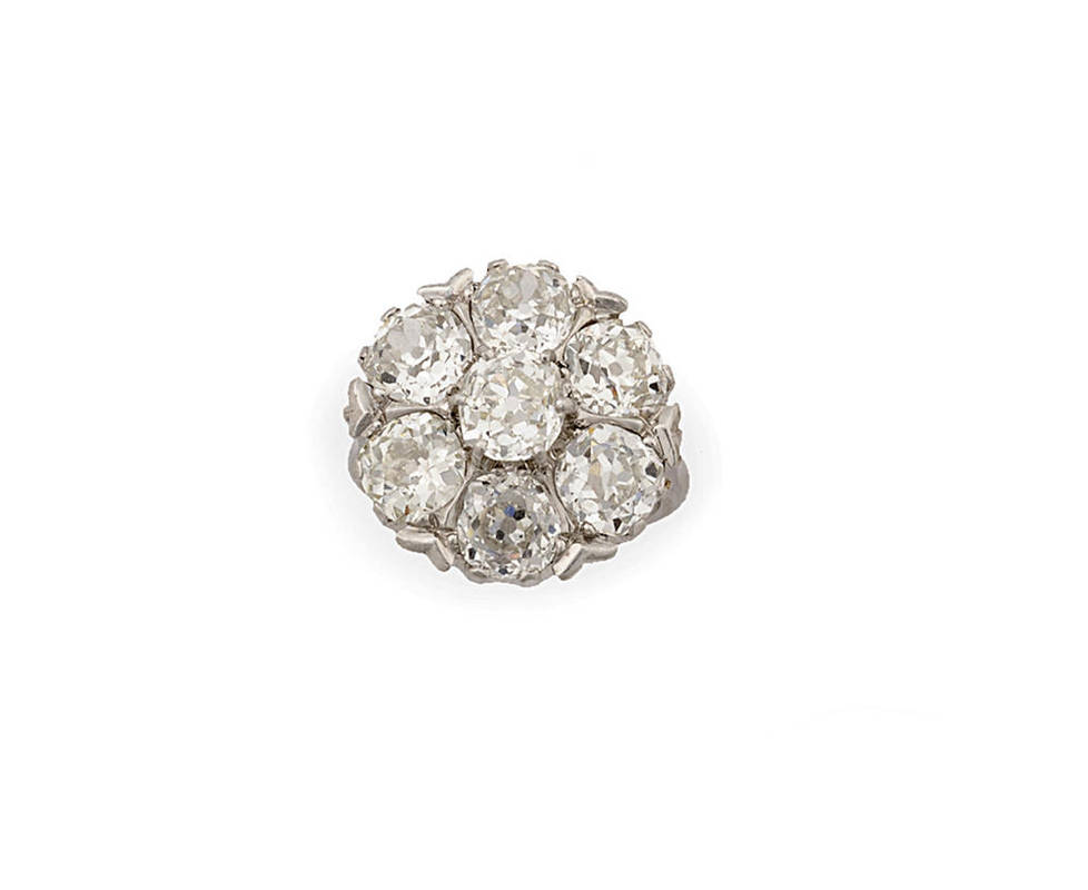 Lot 221 - A Platinum Diamond Seven Stone Cluster Ring,