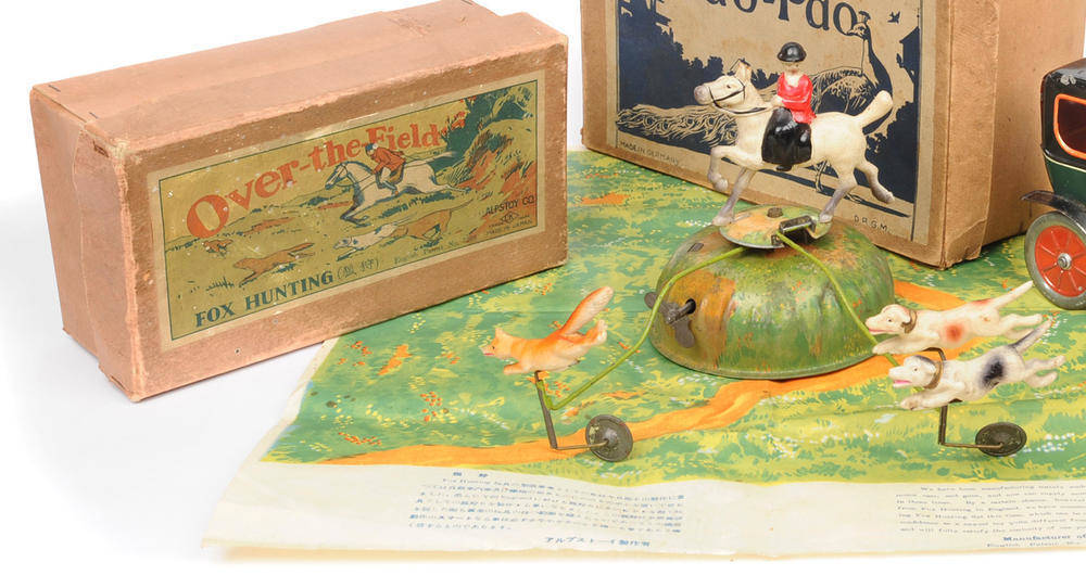 Lot 89 - A Japanese Clockwork Tinplate and Celluloid