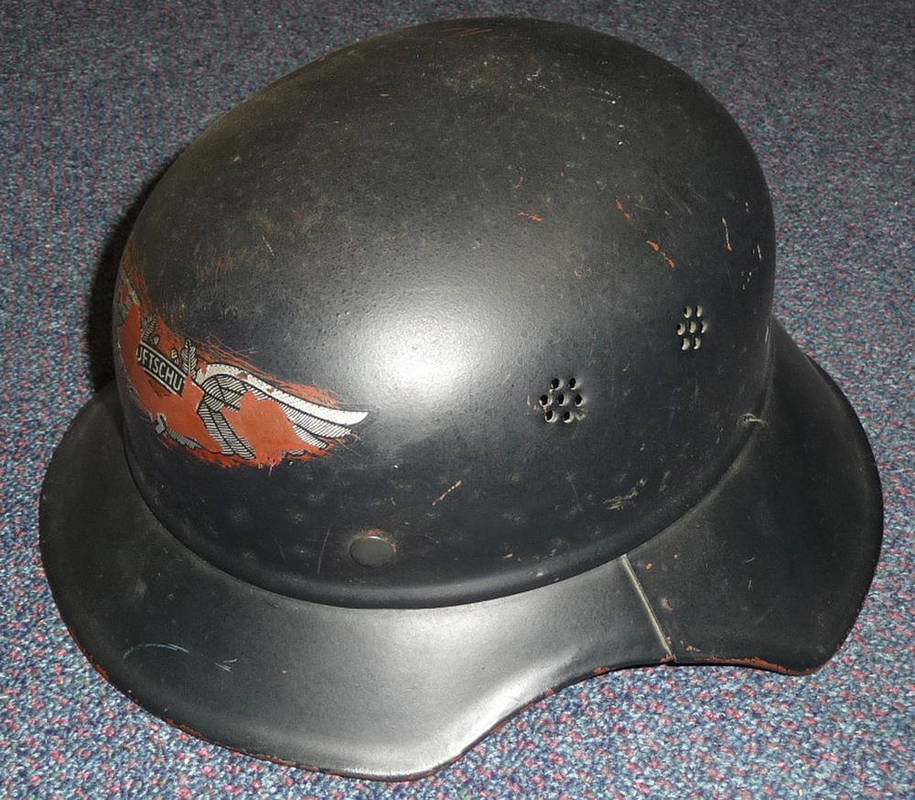 Lot 80 - A German Third Reich Luftshutz Helmet, of two