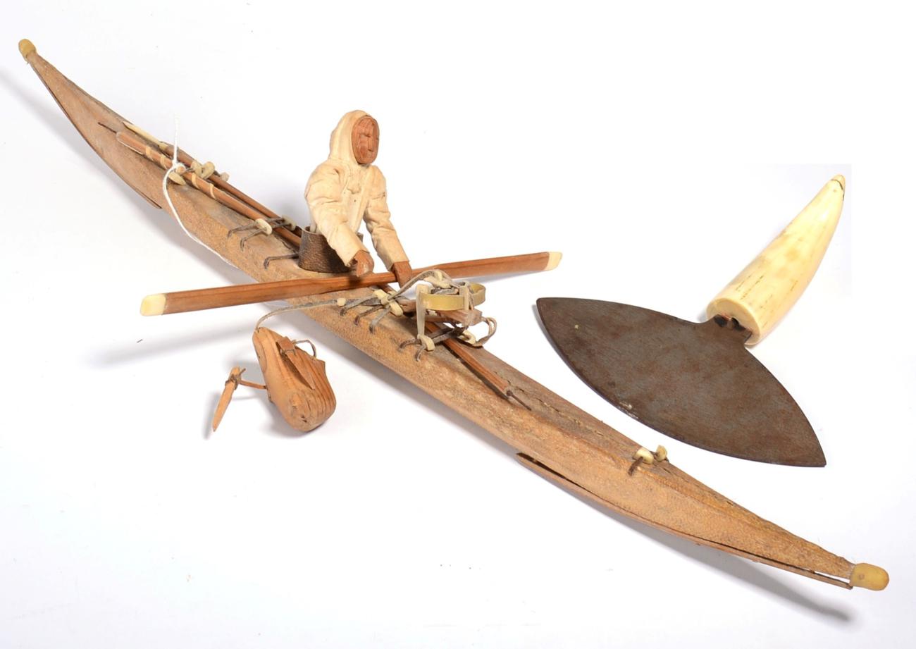 Lot 297 - A Model of an Inuit and Kayak, well-observed,