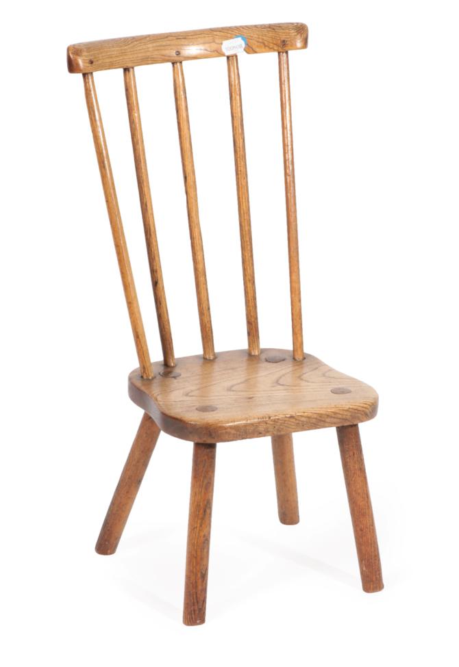 Lot 693 - An Early 19th Century Child's Elm Stick Back