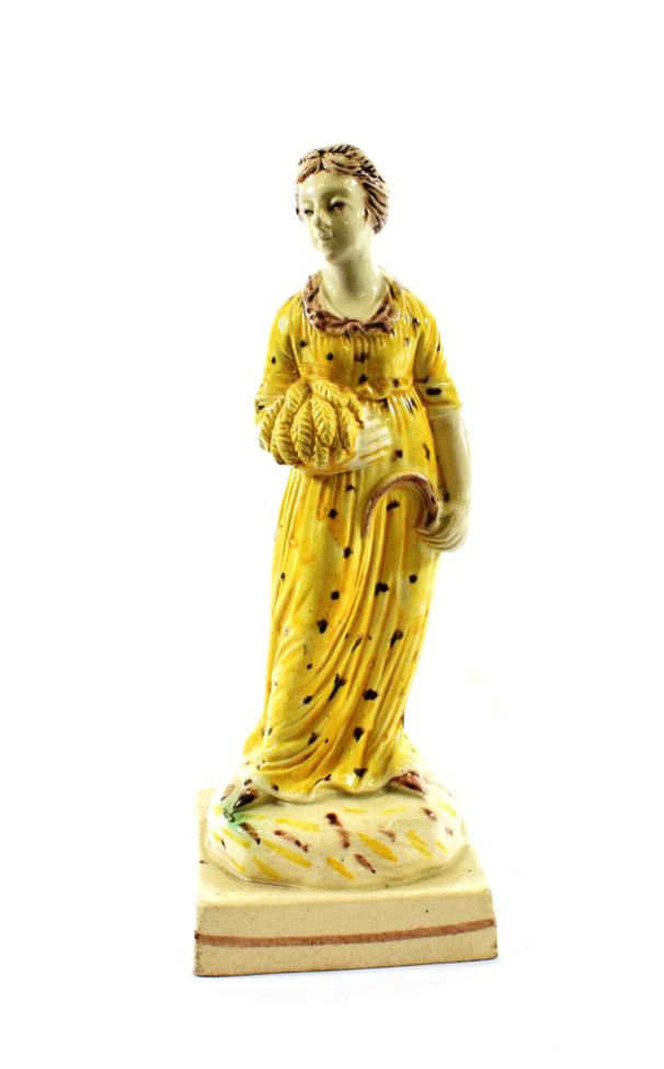Lot 498 - A Prattware Figure of Ceres, circa 1800,