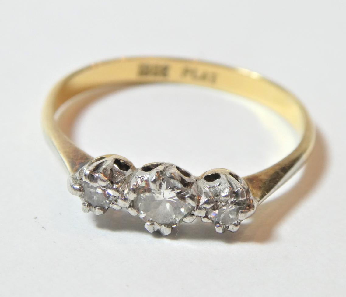 Lot 192 - A diamond three stone ring, stamped '18CT'