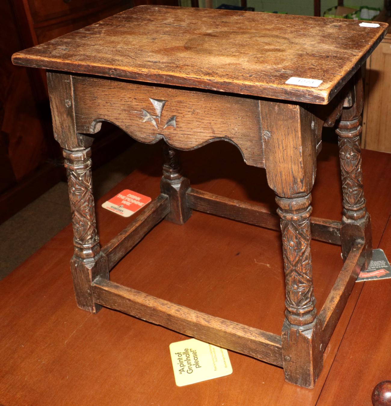 Lot 1273 - A carved oak joined stool, in 17th century