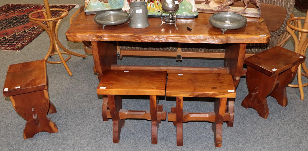 Lot 1231 - A yew wood dining table and four yew wood