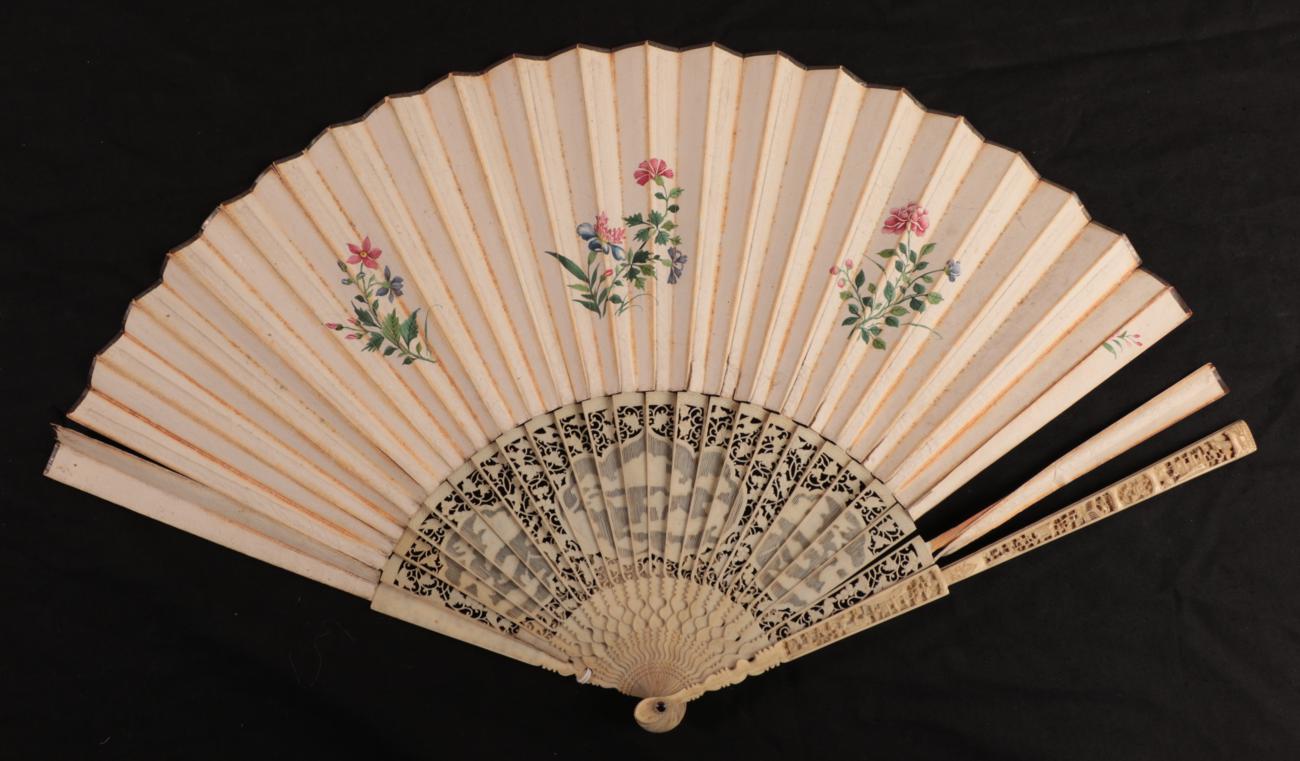 Lot 1109 - An 18th century ivory fan with carved