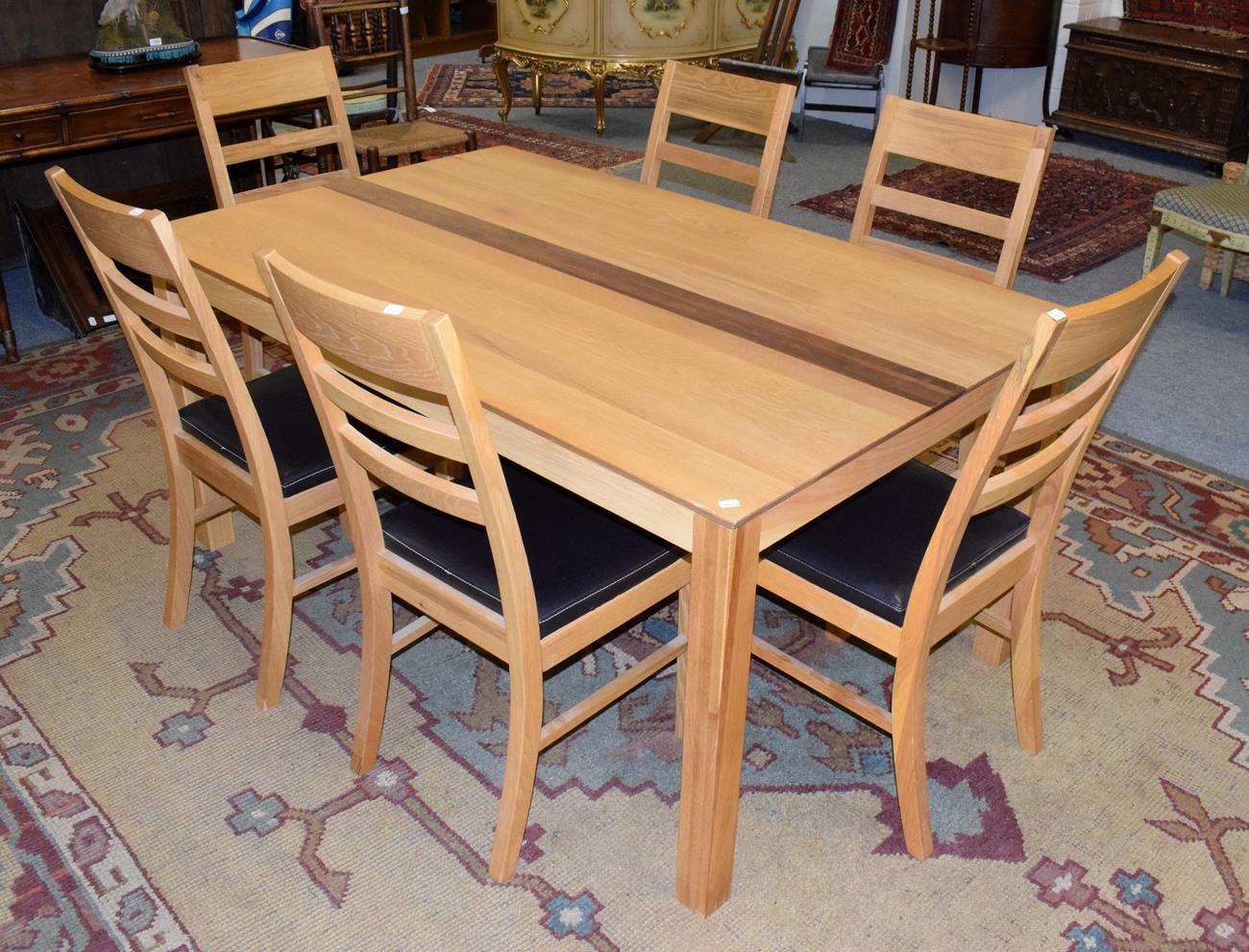 Lot 1221 - A modern solid oak dining table, 160cm wide;