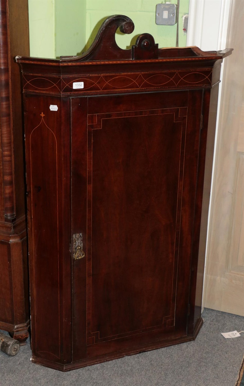 Lot 1332 - George III mahogany corner cupboard with