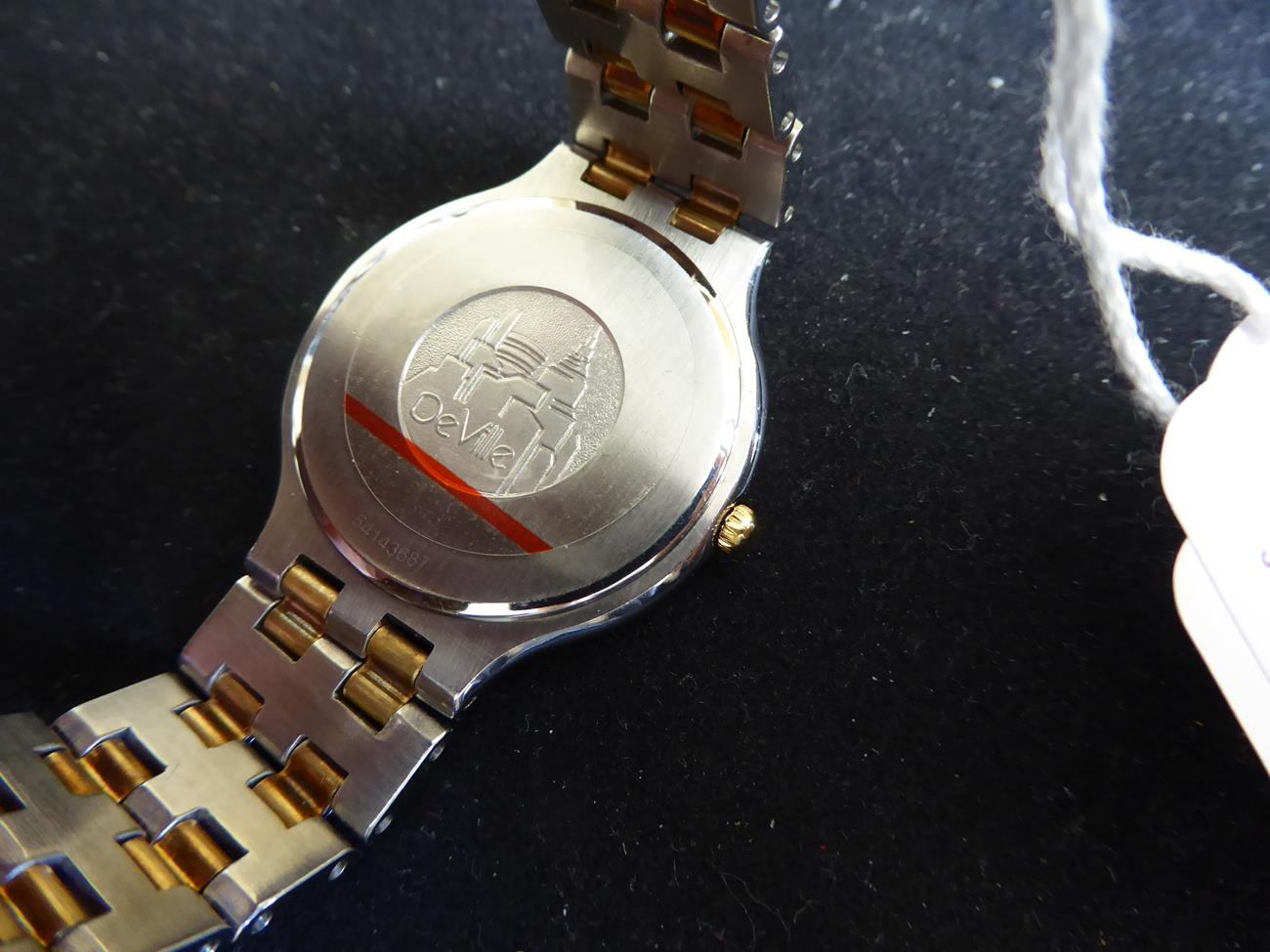 Lot 2230 - A Bi-metal Calendar Wristwatch, signed