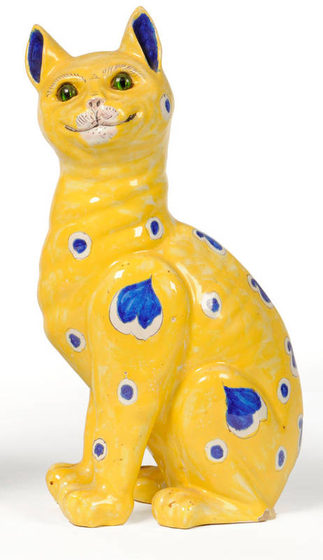 Lot 1465 - A Continental Faience Cat, modelled seated,