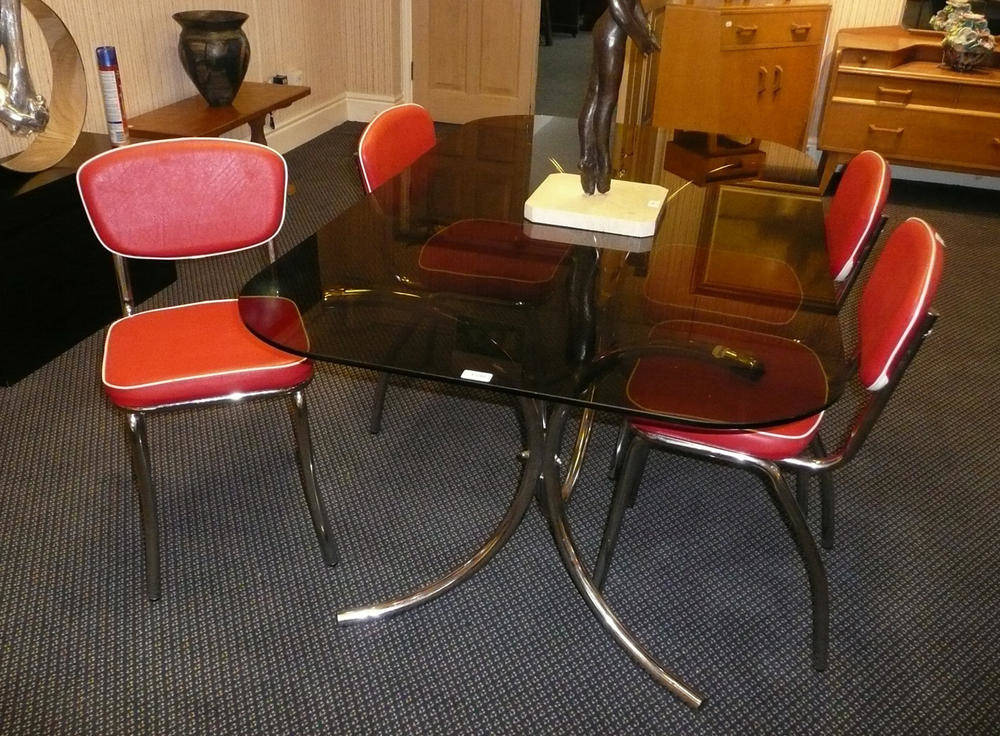Lot 1590 - A Modern Glass and Chrome Table, the shaped