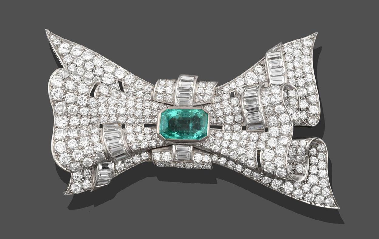 Lot 2278 - An Emerald and Diamond Brooch, stylised as