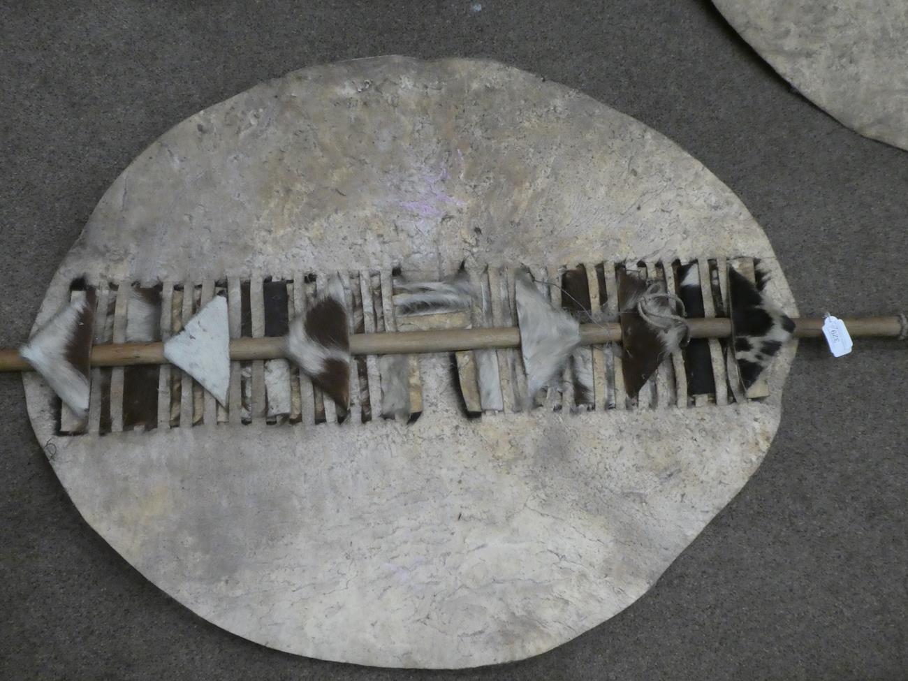 Lot 329 - Two 20th Century Zulu Cow Hide Shields, each