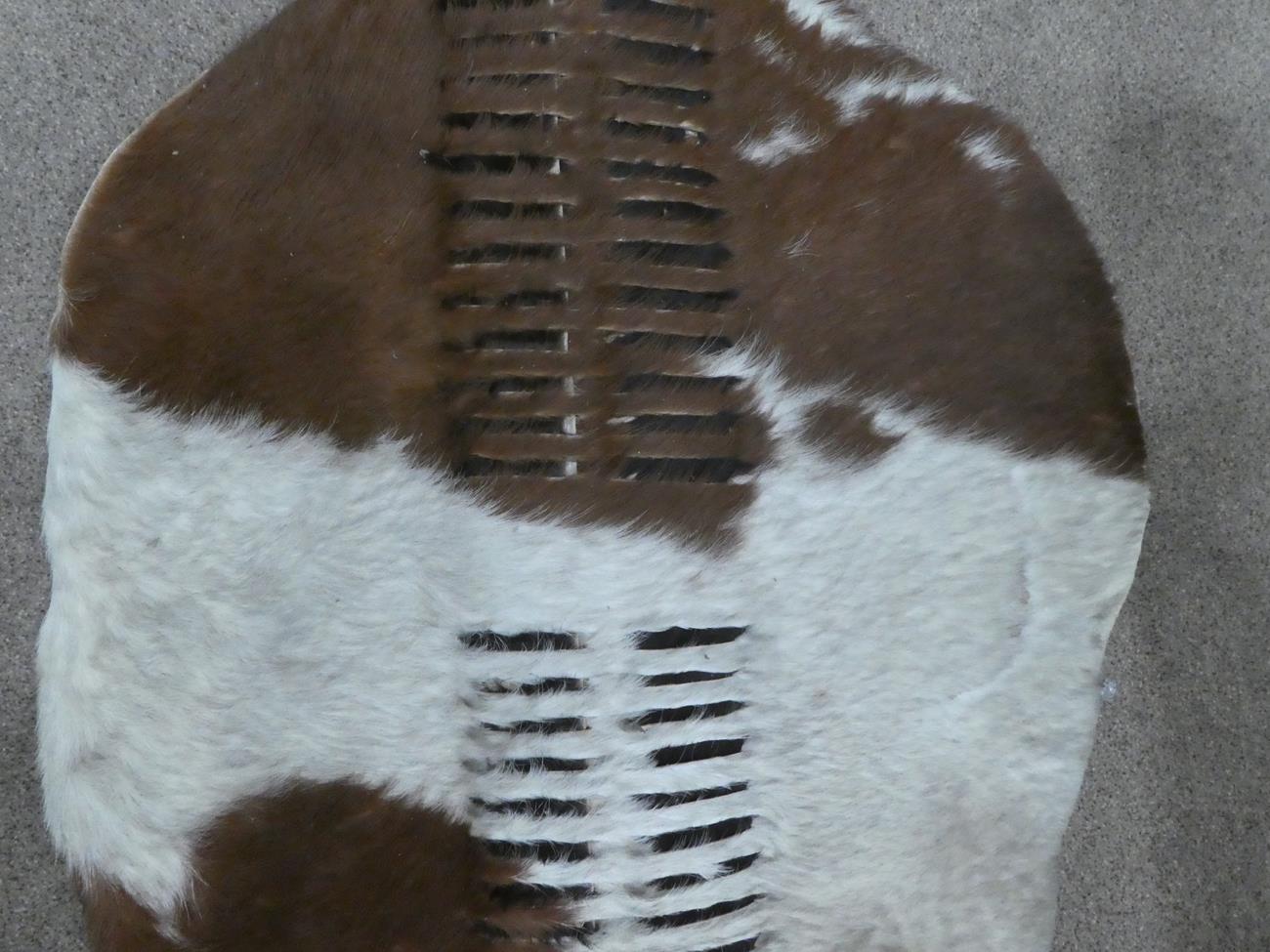 Lot 329 - Two 20th Century Zulu Cow Hide Shields, each
