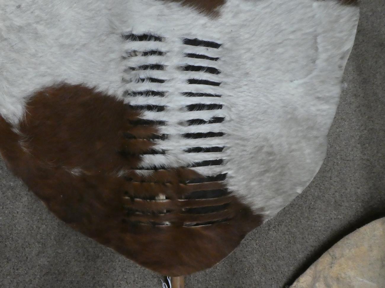 Lot 329 - Two 20th Century Zulu Cow Hide Shields, each
