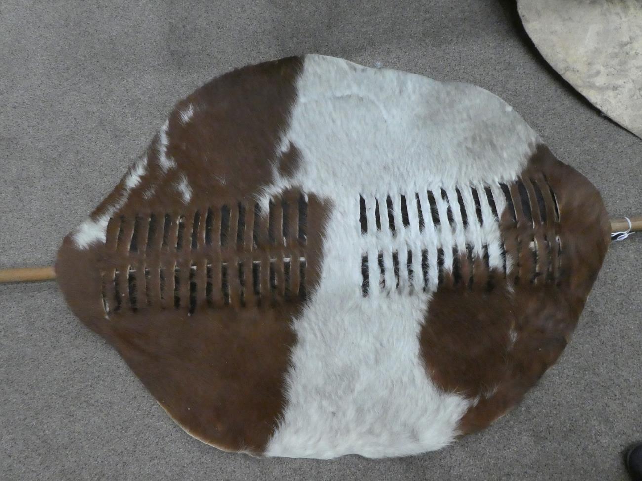 Lot 329 - Two 20th Century Zulu Cow Hide Shields, each