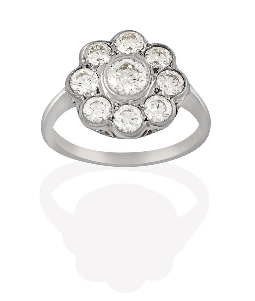 Lot 2114 - A Diamond Cluster Ring, the round brilliant