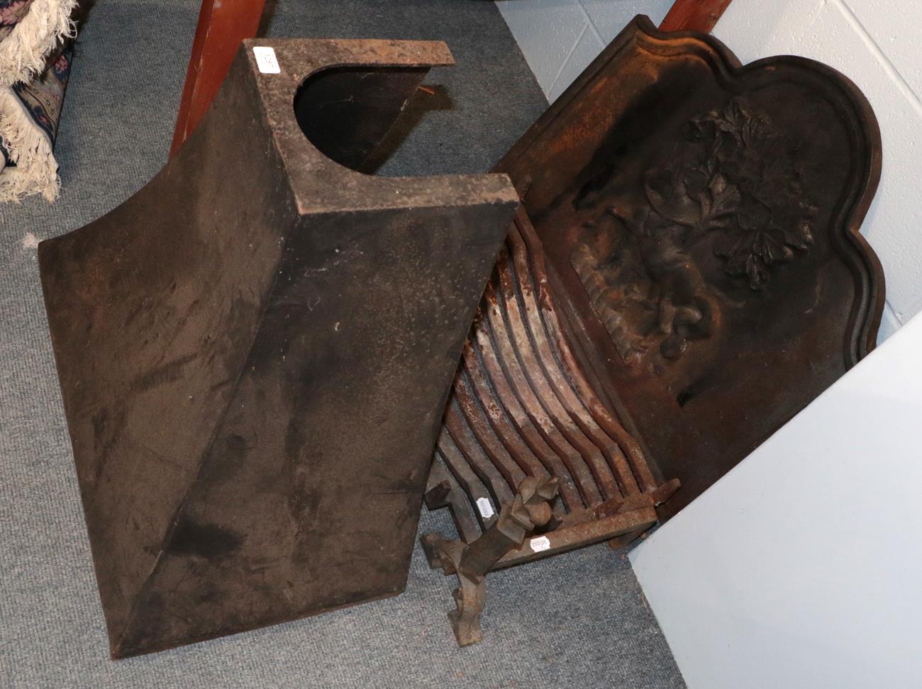 Lot 1287 - A cast iron fire back decorated with relief