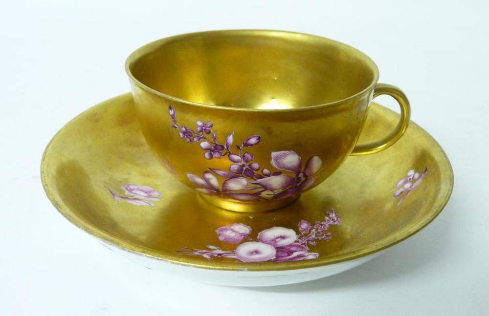 Lot 161 - A Meissen Gold Ground Teacup and Saucer,