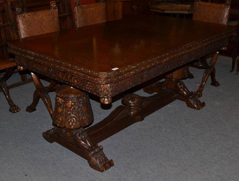 Lot 1467 - A Carved Oak Extending Refectory Dining